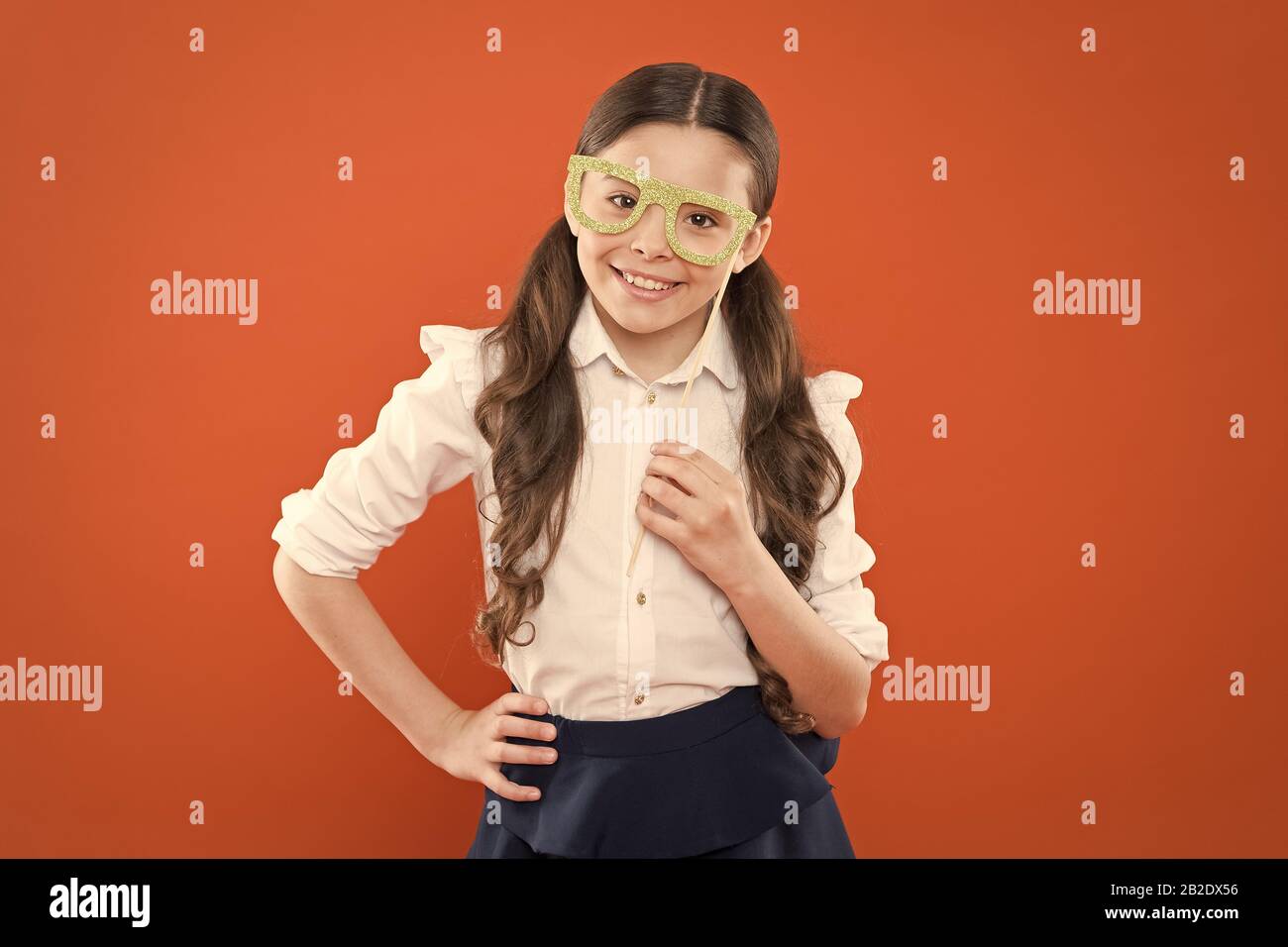 What does it mean being smart. Little smart schoolgirl on orange ...