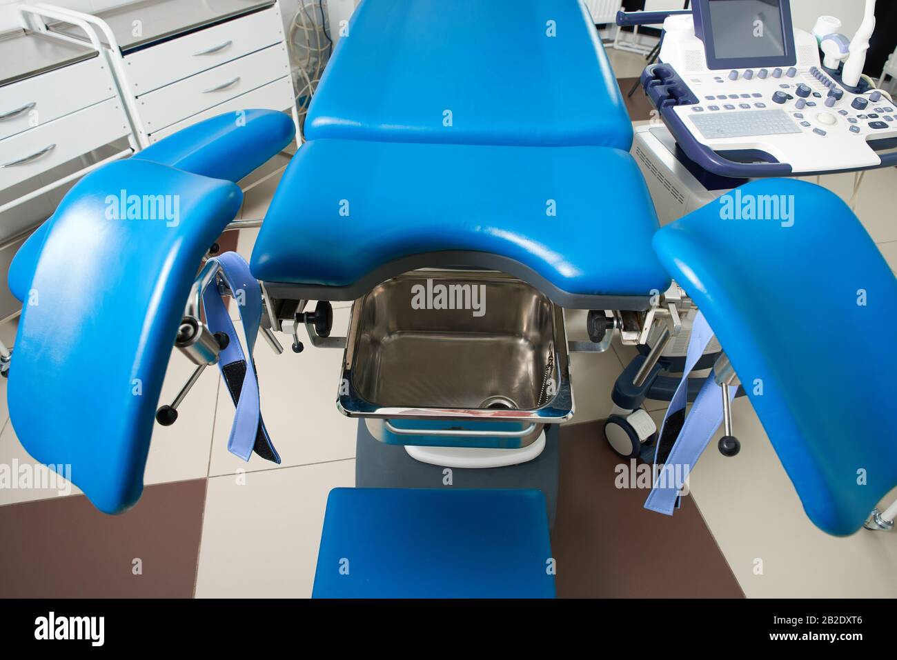 Gynecological room with chair and equipment Stock Photo - Alamy