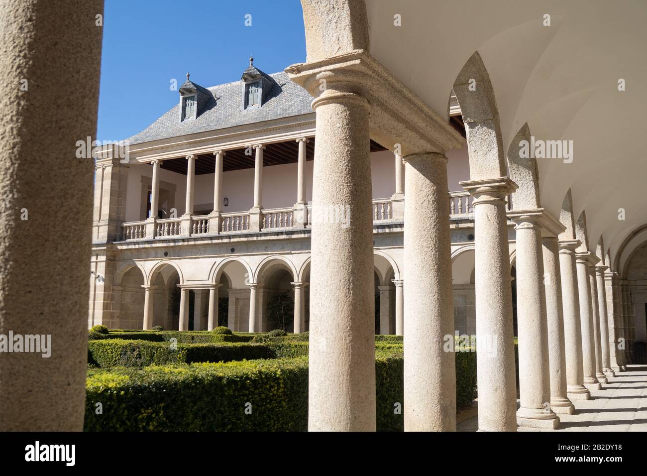 Courtyard, garden and arches of the monastery of El Escorial in madrid ...