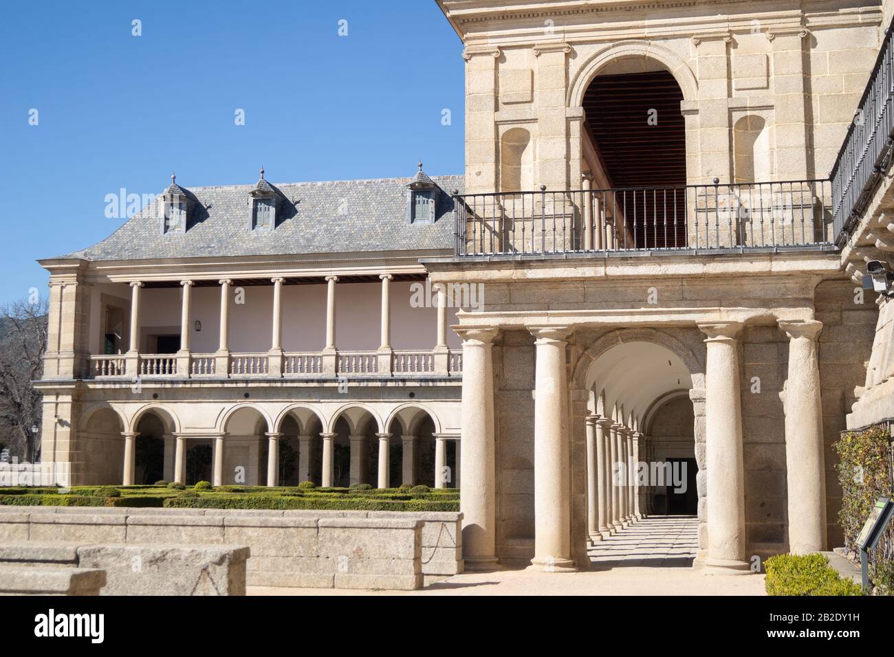Courtyard, garden and arches of the monastery of El Escorial in Madrid ...