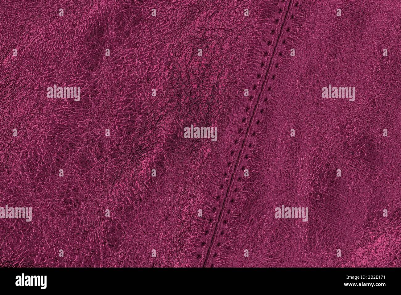 Texture of genuine crumpled leather, stitches, seam with plain threads ...