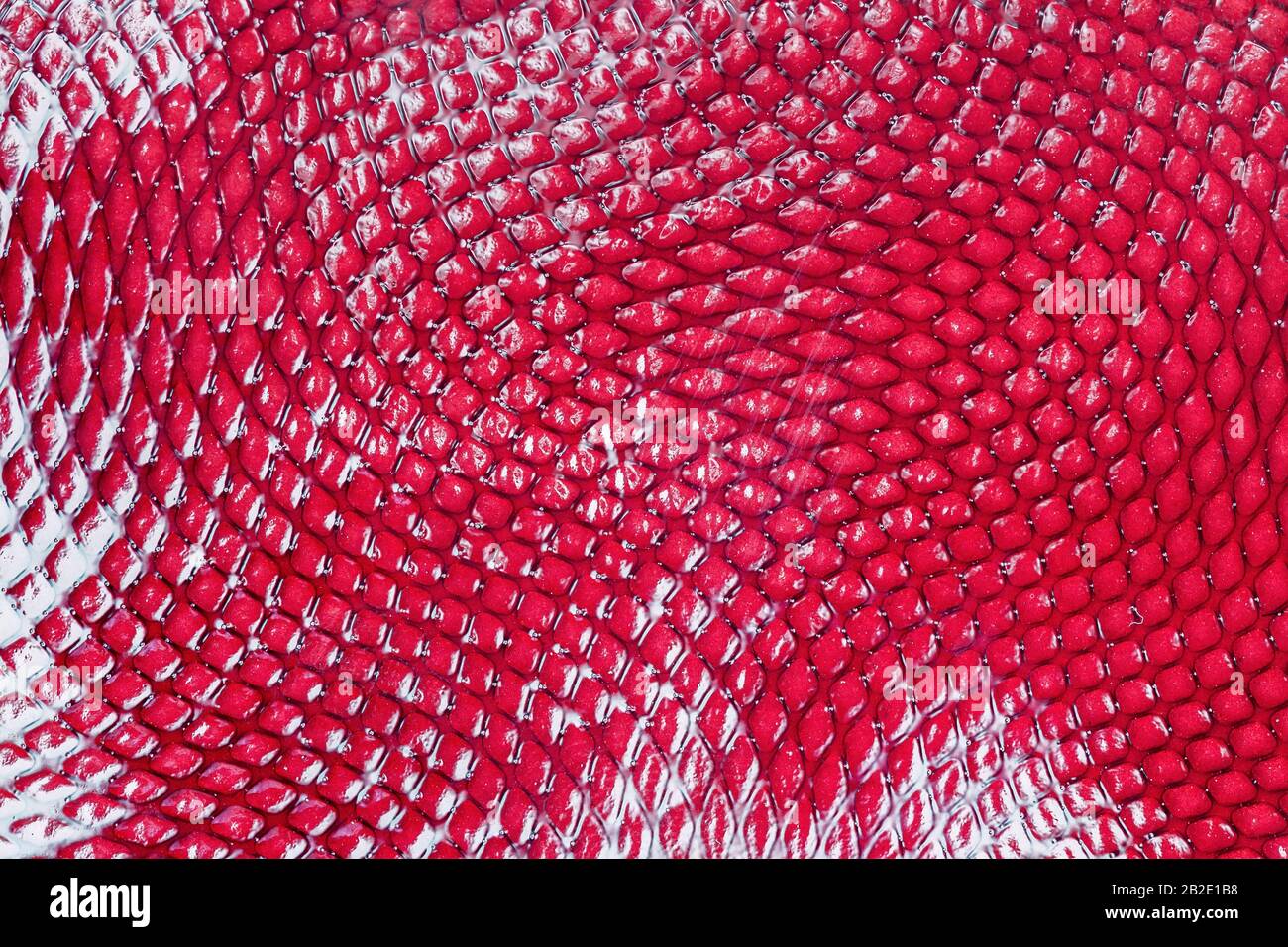 Abstract red patent leather texture with lighter highlights, embossed ...