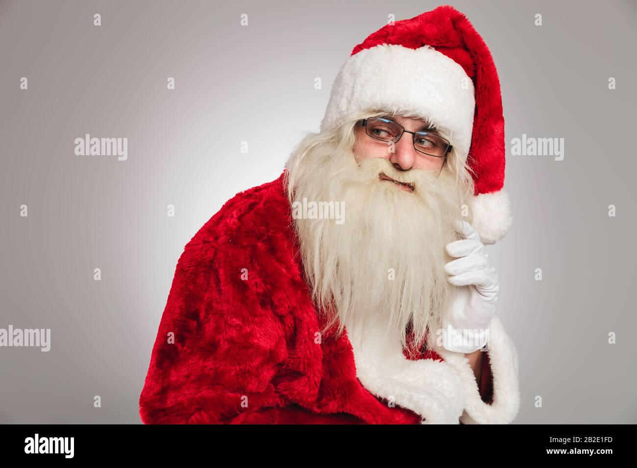 side view of santa claus thinking on grey backround Stock Photo - Alamy