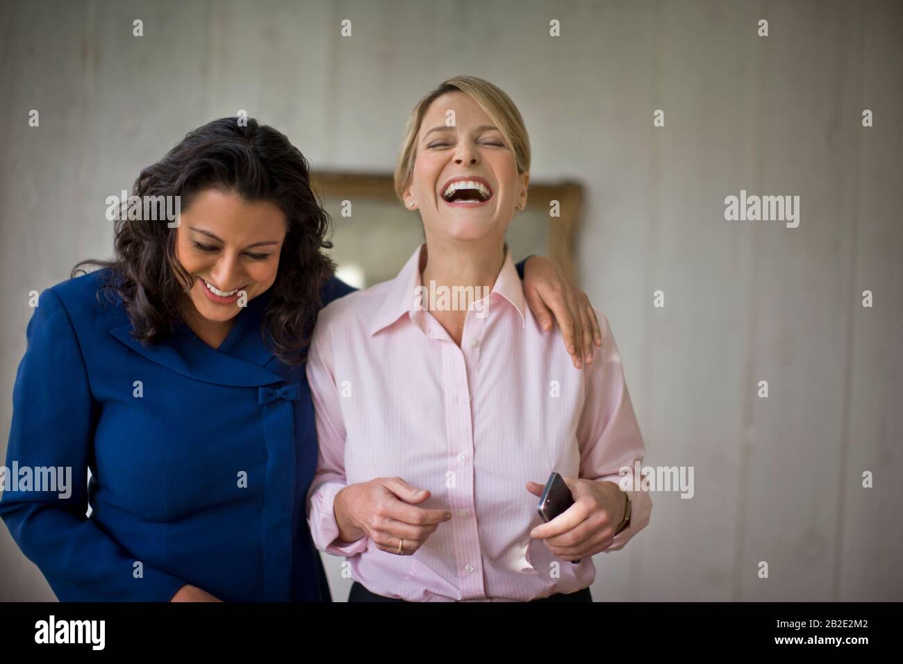 Two women laughing hi-res stock photography and images - Alamy
