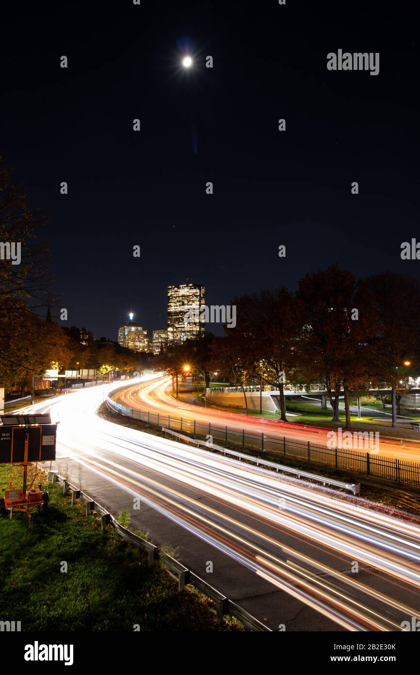 light trails at rush hour in the fall overlooking the boston skyline at ...