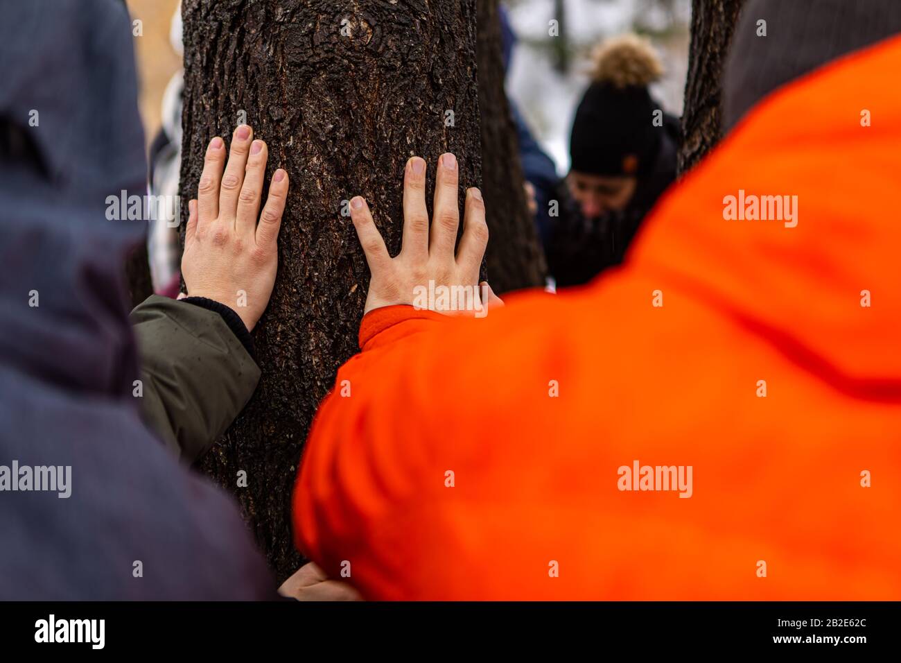 A group of people from the environmental movement gathered around a ...