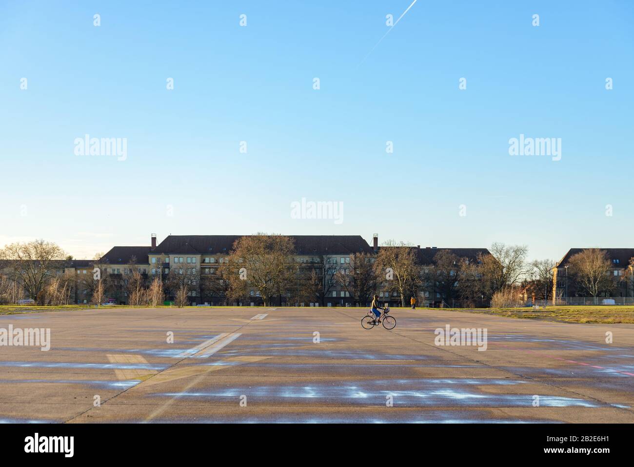 People cycle on former asphalt landing field at Tempelhof park and ...