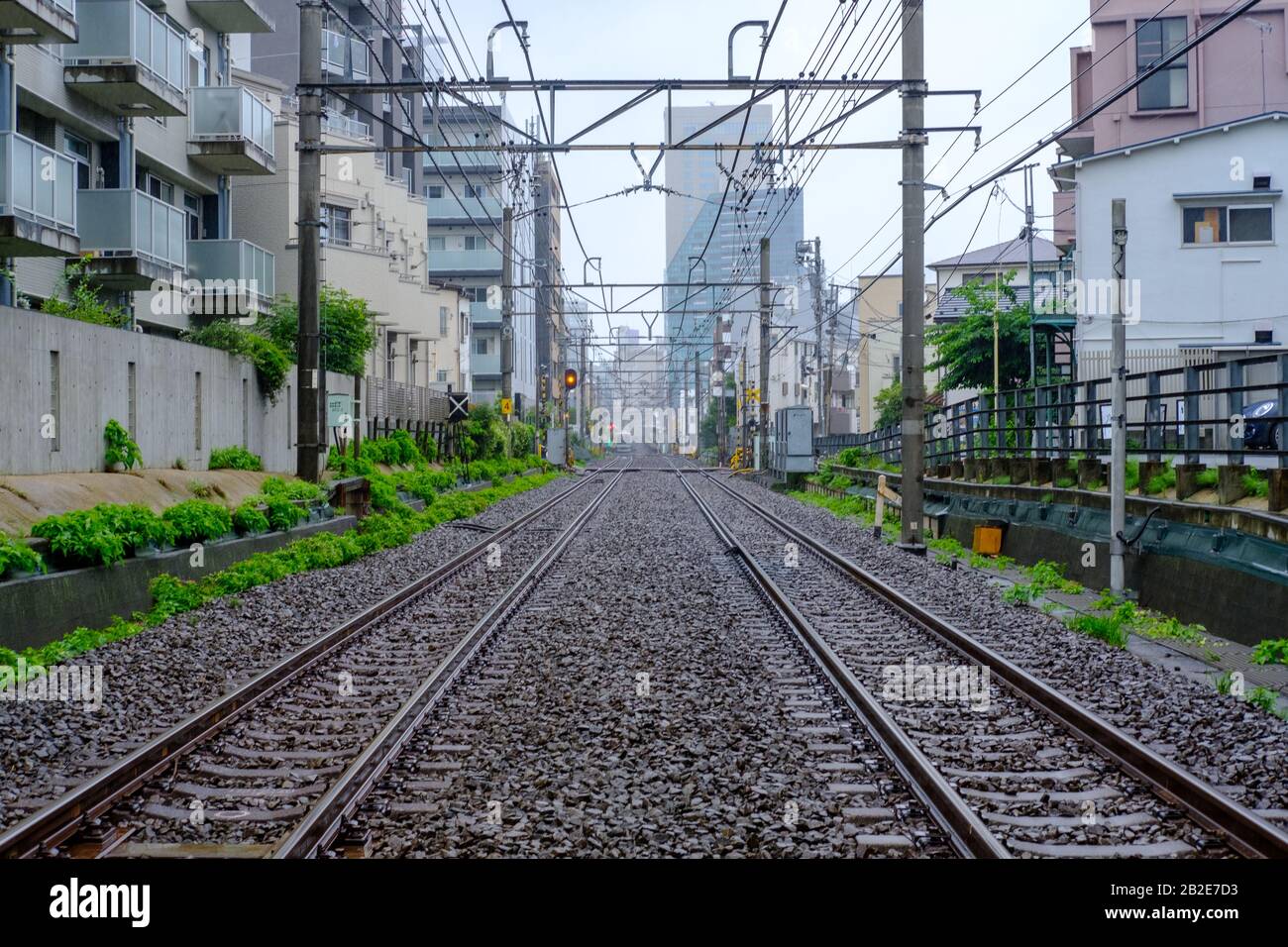 Train tracks cutting straight through the city in Tokyo, Japan Stock ...