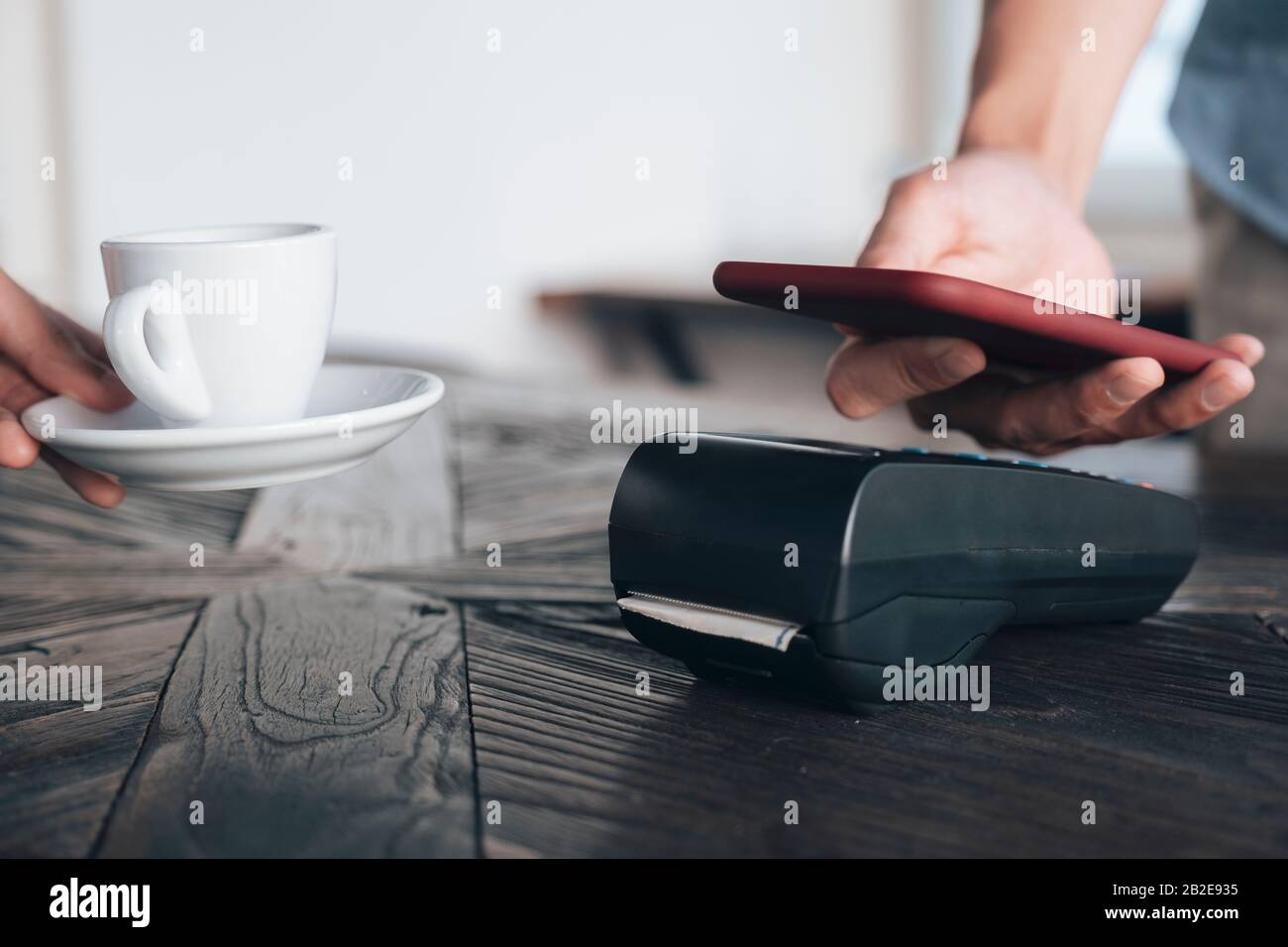 Paying with mobile phone. NFC payment technology Stock Photo - Alamy