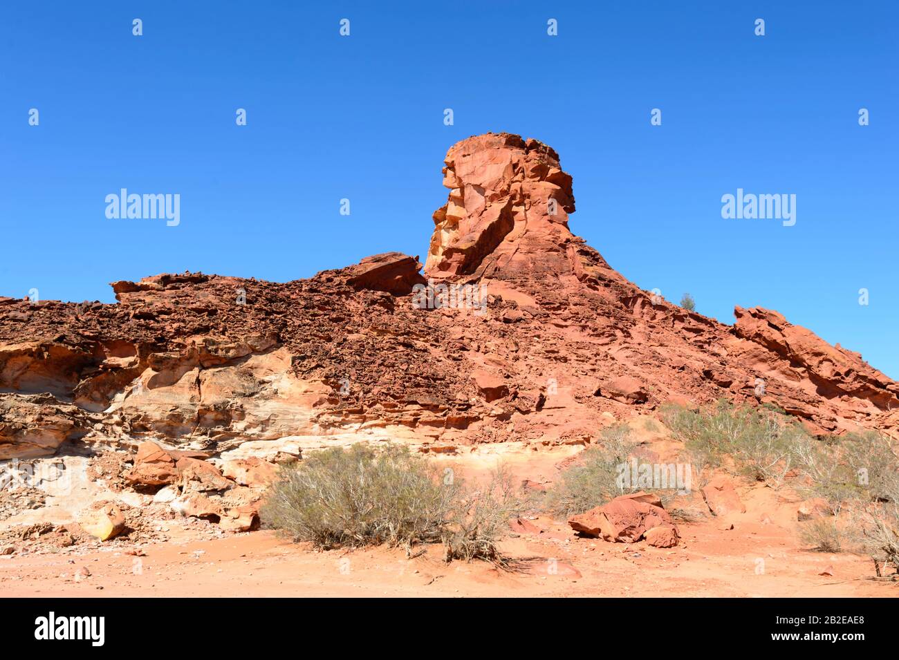 Bright red sandstone outcrop at Rainbow Valley Conservation Reserve ...
