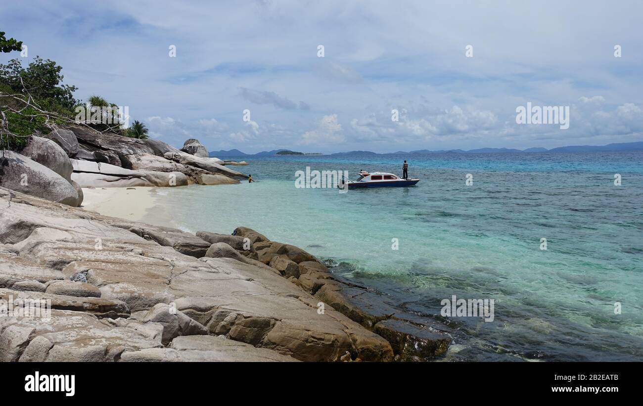 Anambas Islands Indonesia - beach scenery with anchoring fishing boat ...