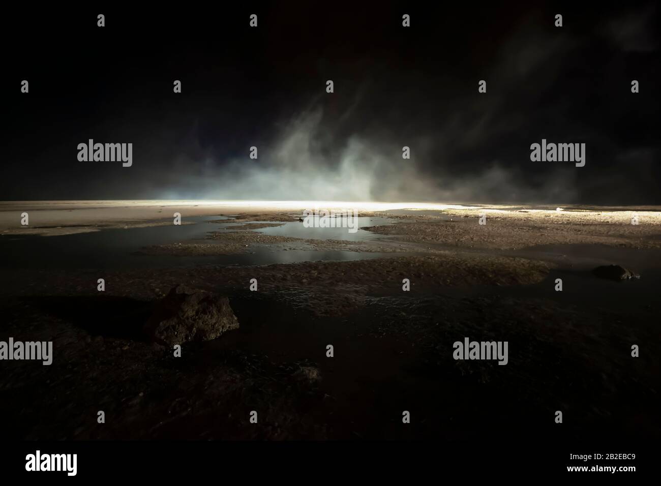abstract mars like terrain, muddy puddles of water textures, rocks ...