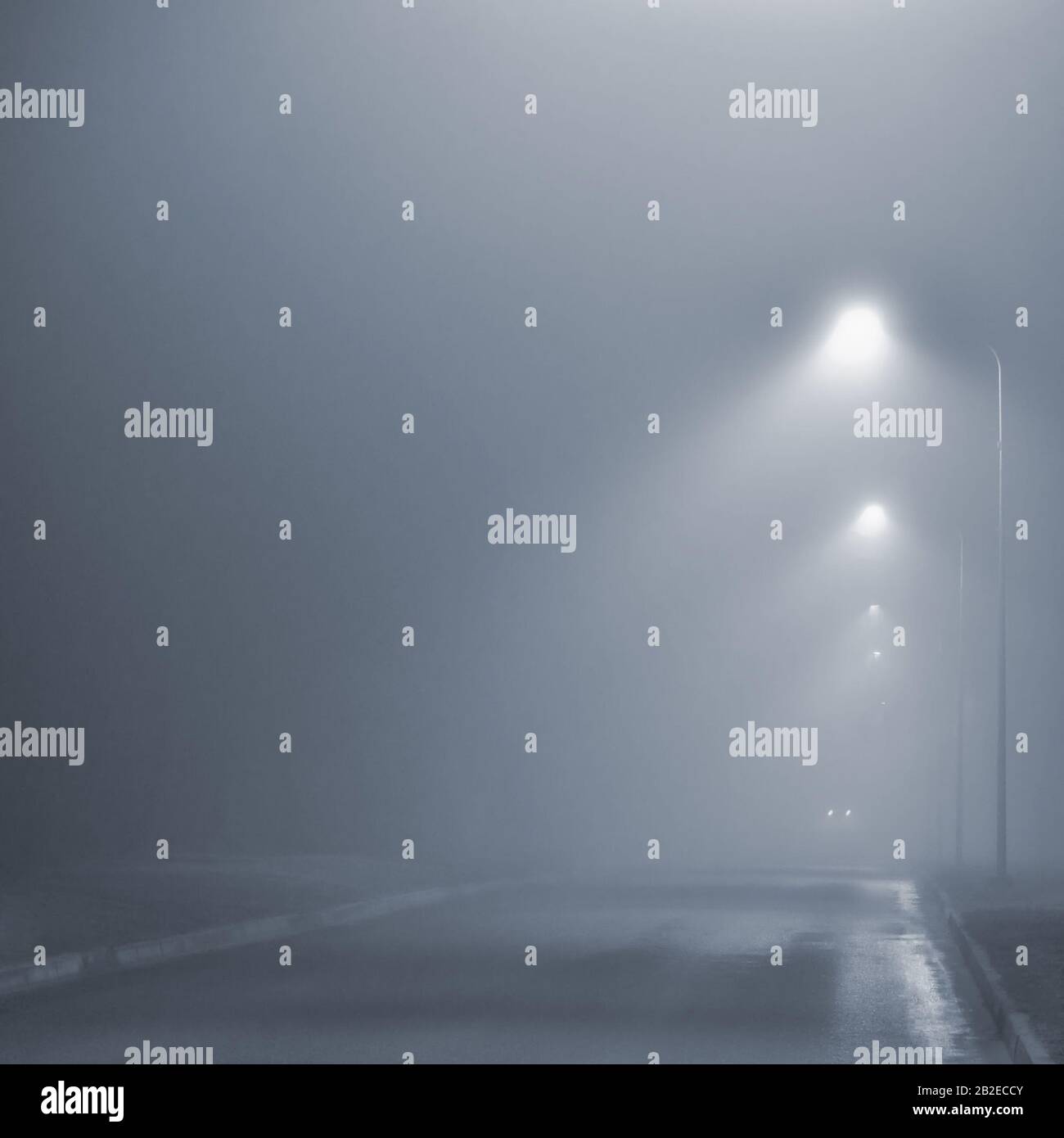 Street lights, foggy misty night, lamp post lanterns, deserted road in ...