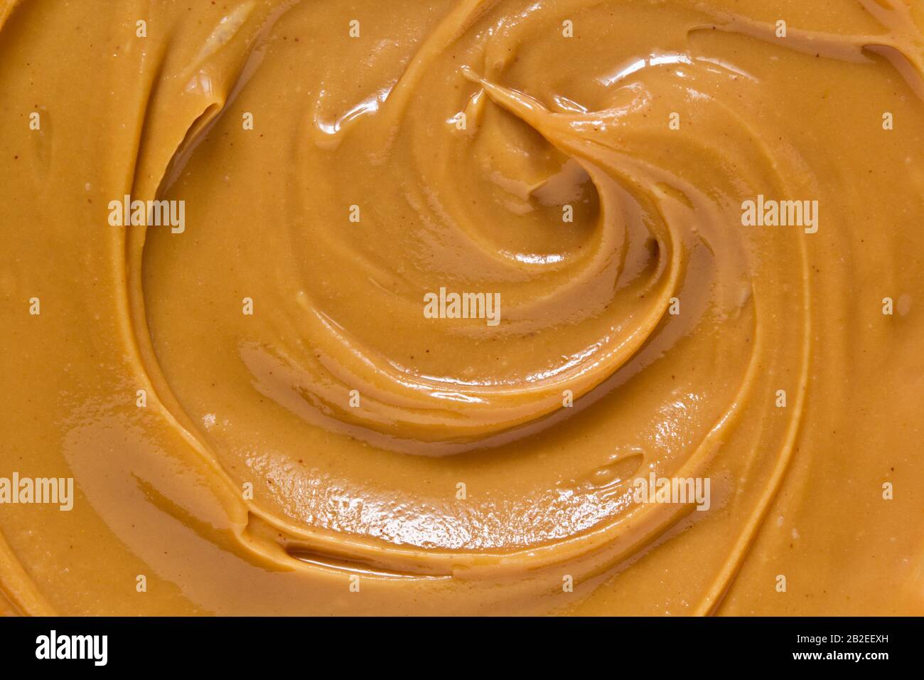 Peanut butter texture background. Creamy smooth brown nut spread swirl ...