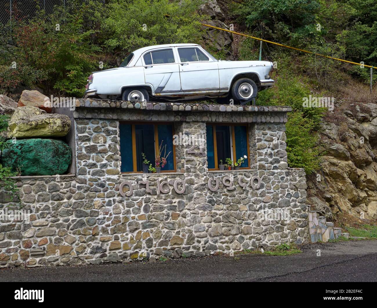 Gaz Moscovitch cars on the roof building in Vank Karabakh Stock Photo ...