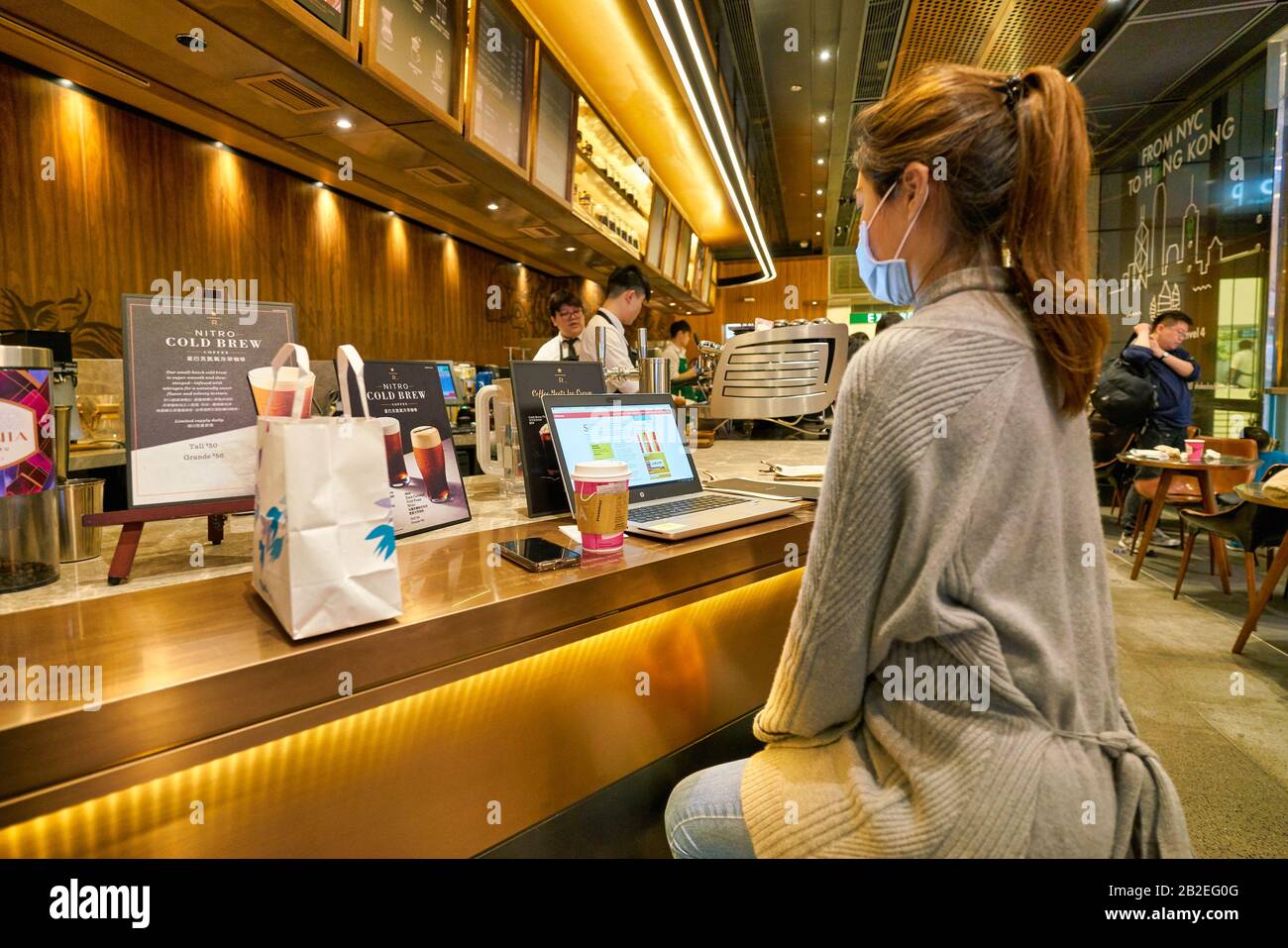 HONG KONG, CHINA - JANUARY 22, 2019: woman sit at Starbucks Coffee at ...