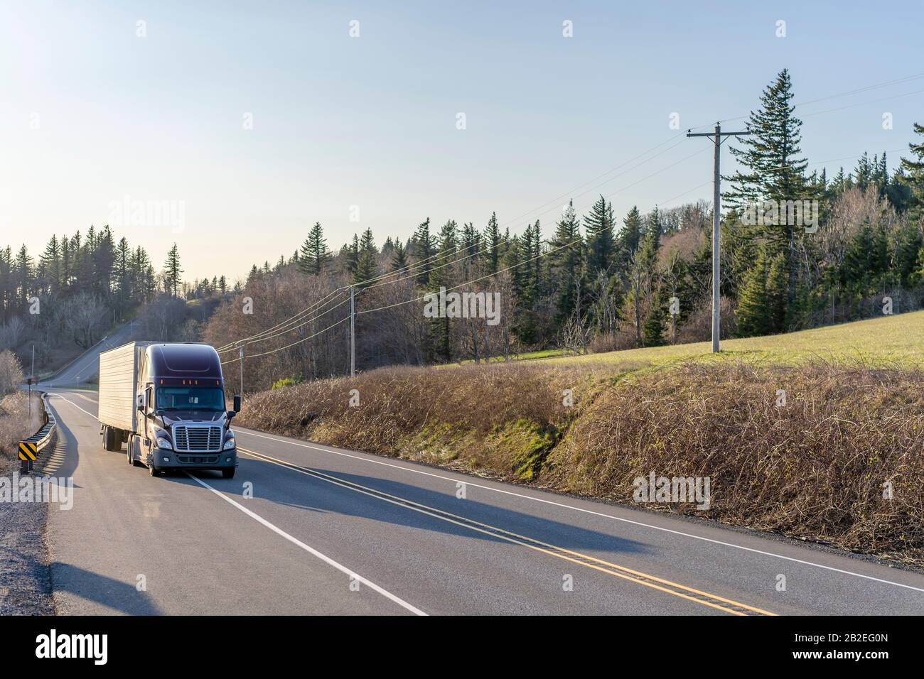 Dark brown big rig long haul diesel semi truck with high cab ...