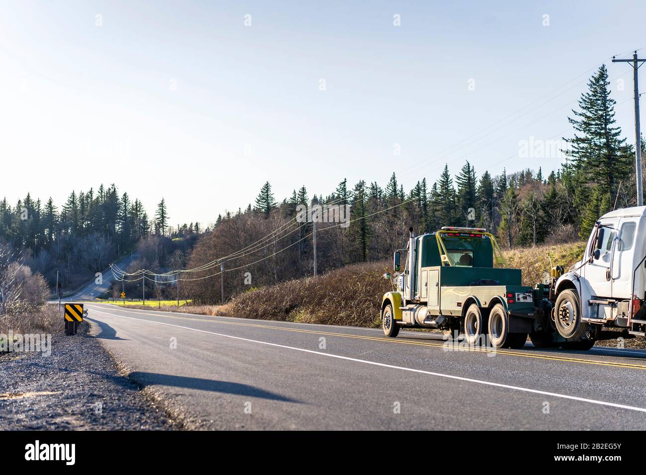 Industrial transportation Big rig green towing semi truck tractor with ...