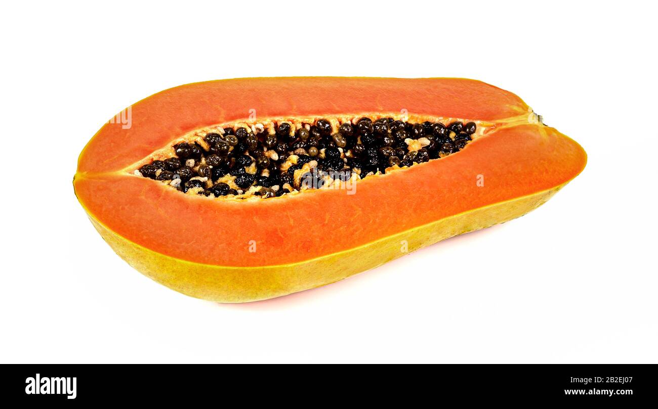 half of ripe papaya fruit with seeds isolated on white background Stock ...