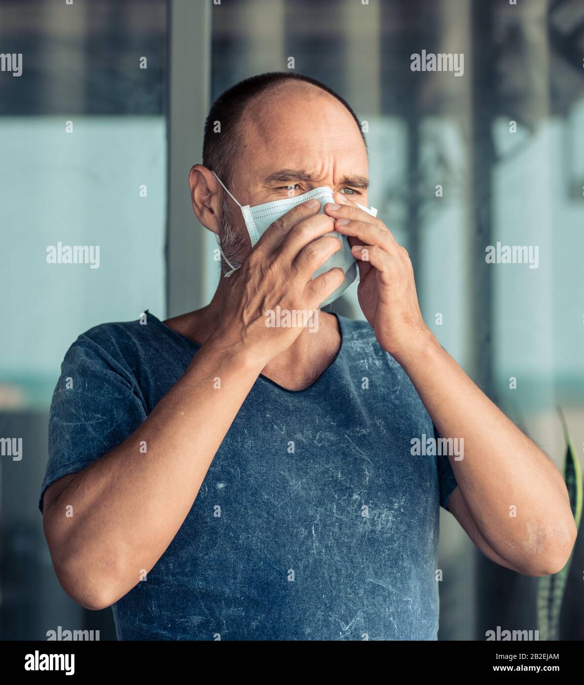 Man wearing facial disposable mask to avoid viral infection. Virus ...