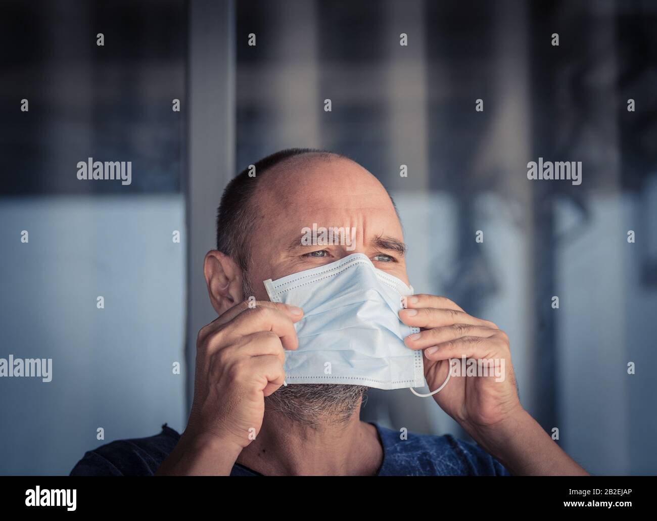 Man wearing facial disposable mask to avoid viral infection. Virus ...