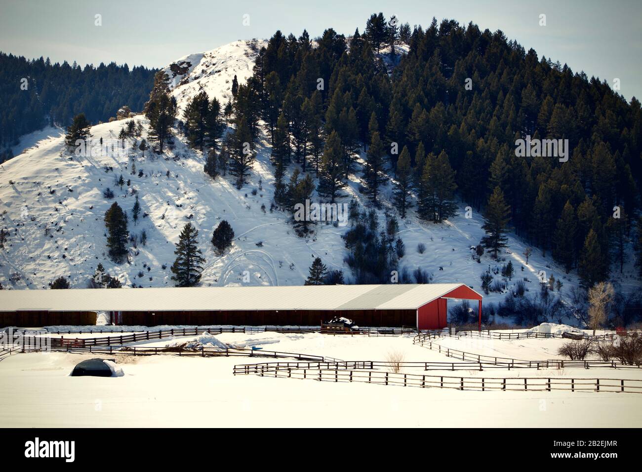 Red Barn with mountain background Stock Photo - Alamy