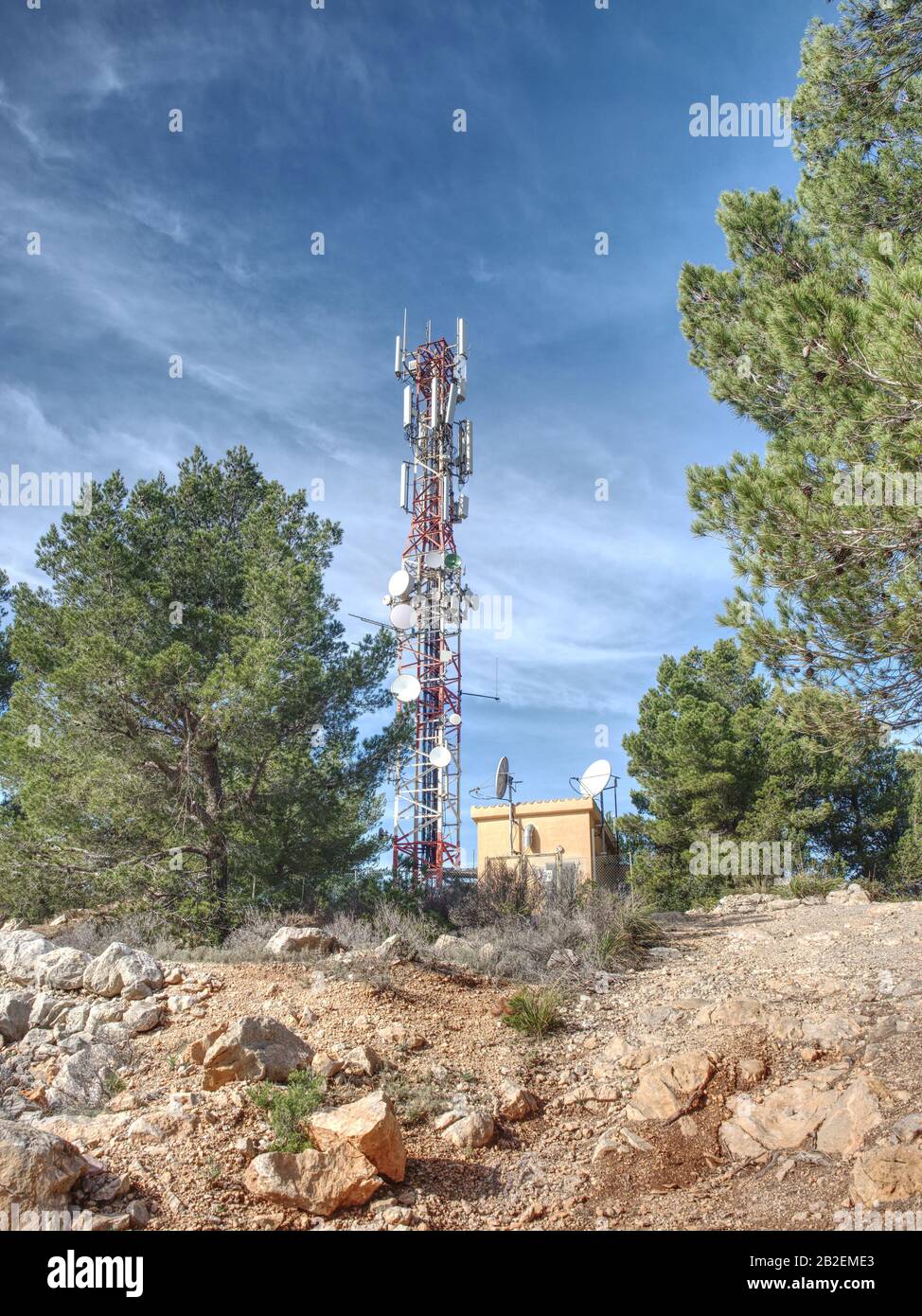 Remote mountain communications center with antennas on steel tower ...