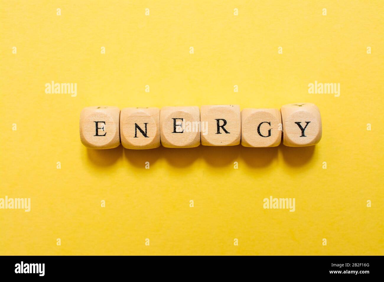 the word Energy, text made with dice on yellow background Stock Photo ...