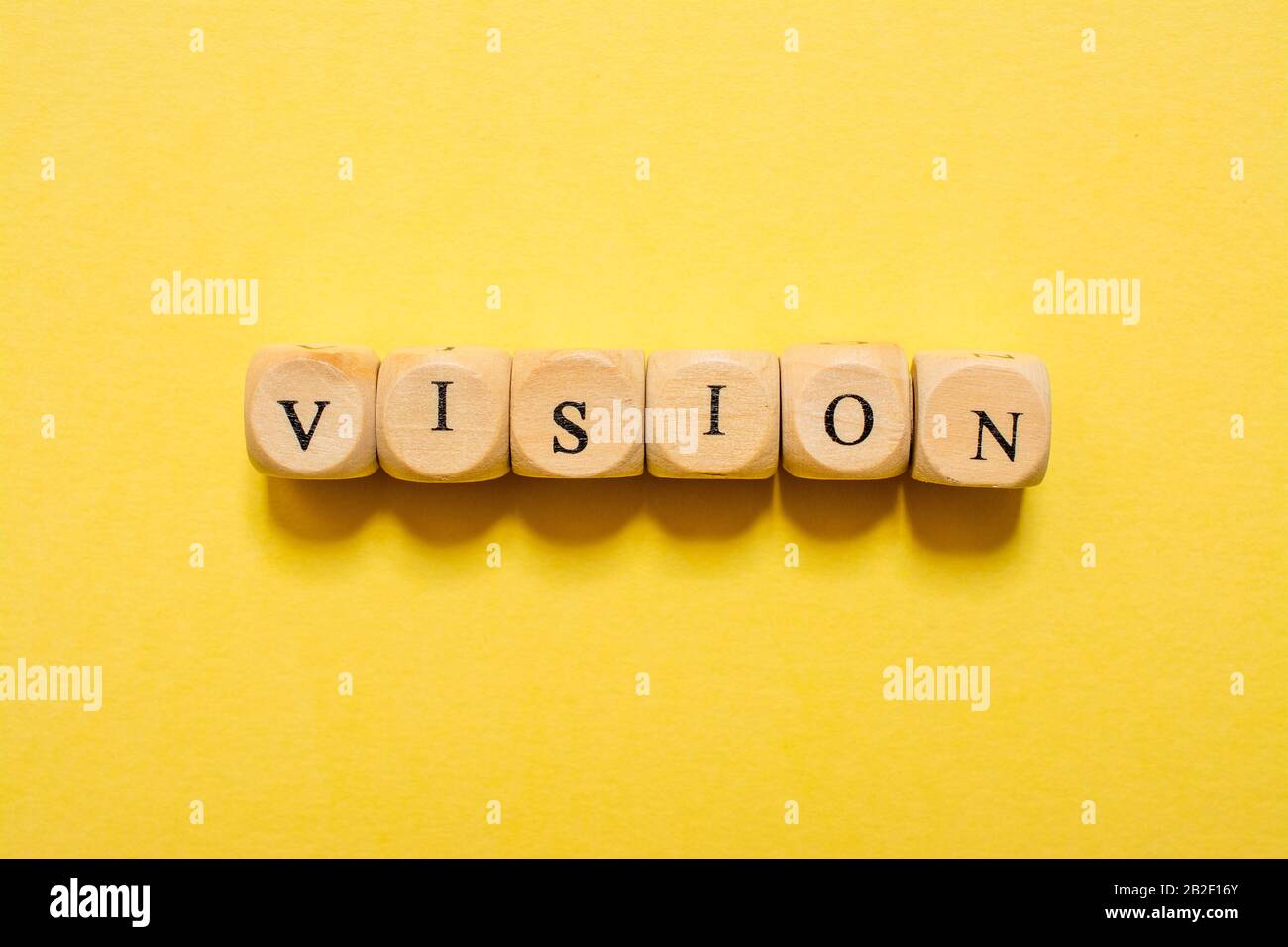 the word Vision, text made with dice on yellow background Stock Photo ...