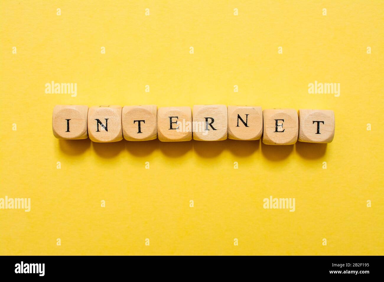 the word Internet, text made with dice on yellow background Stock Photo ...