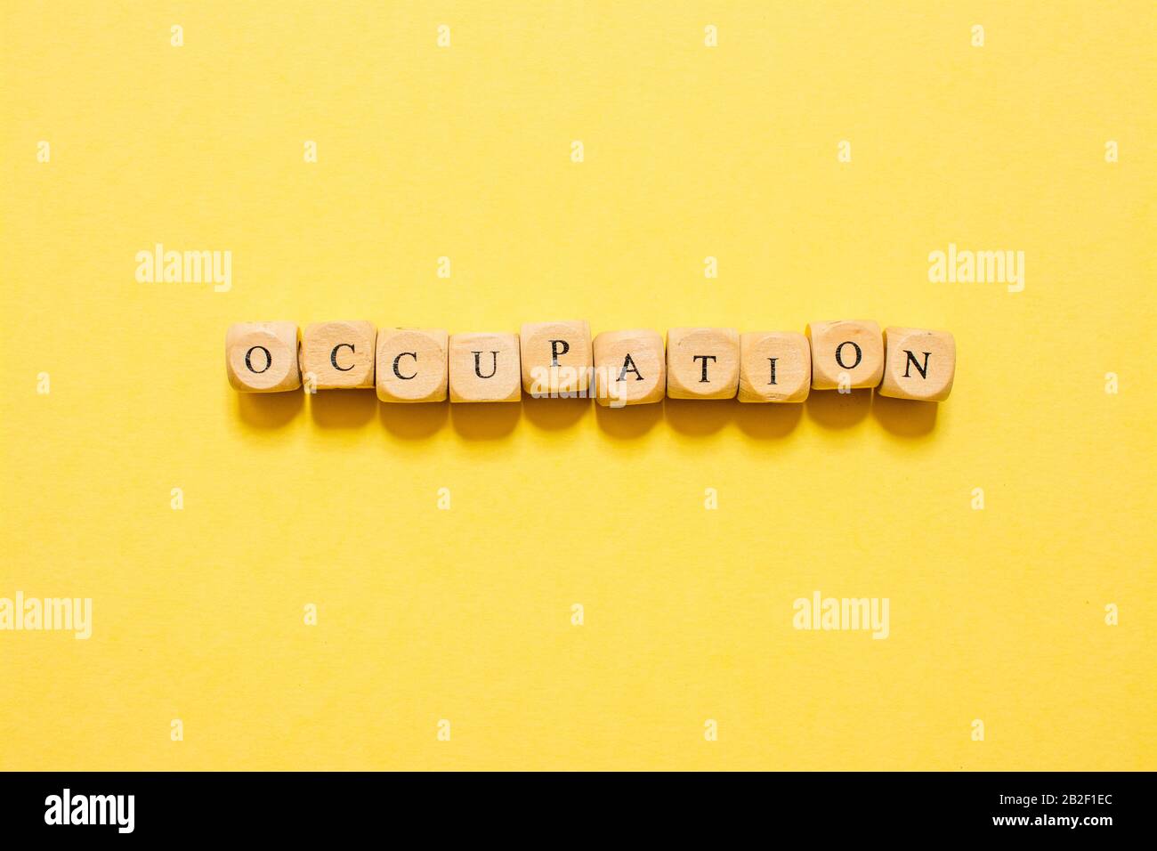the word Occupation, text made with dice on yellow background Stock ...