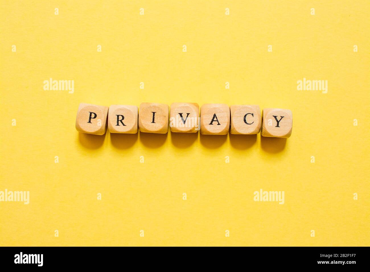 the word Privacy, text made with dice on yellow background Stock Photo ...