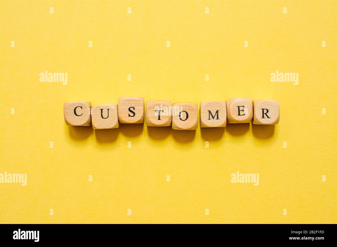 the word Customer, text made with dice on yellow background Stock Photo ...