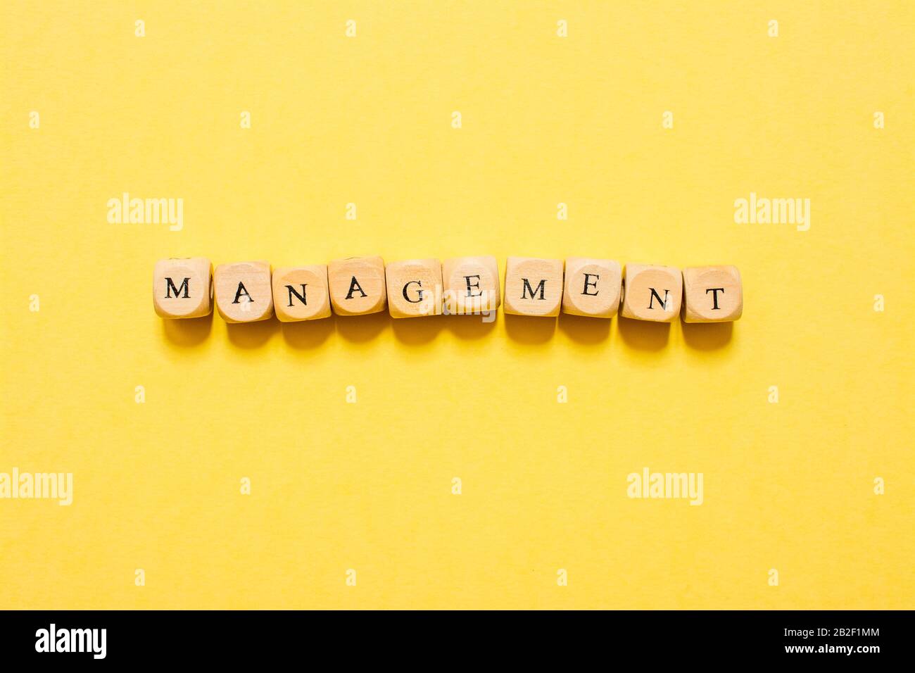 the word Management, text made with dice on yellow background Stock ...