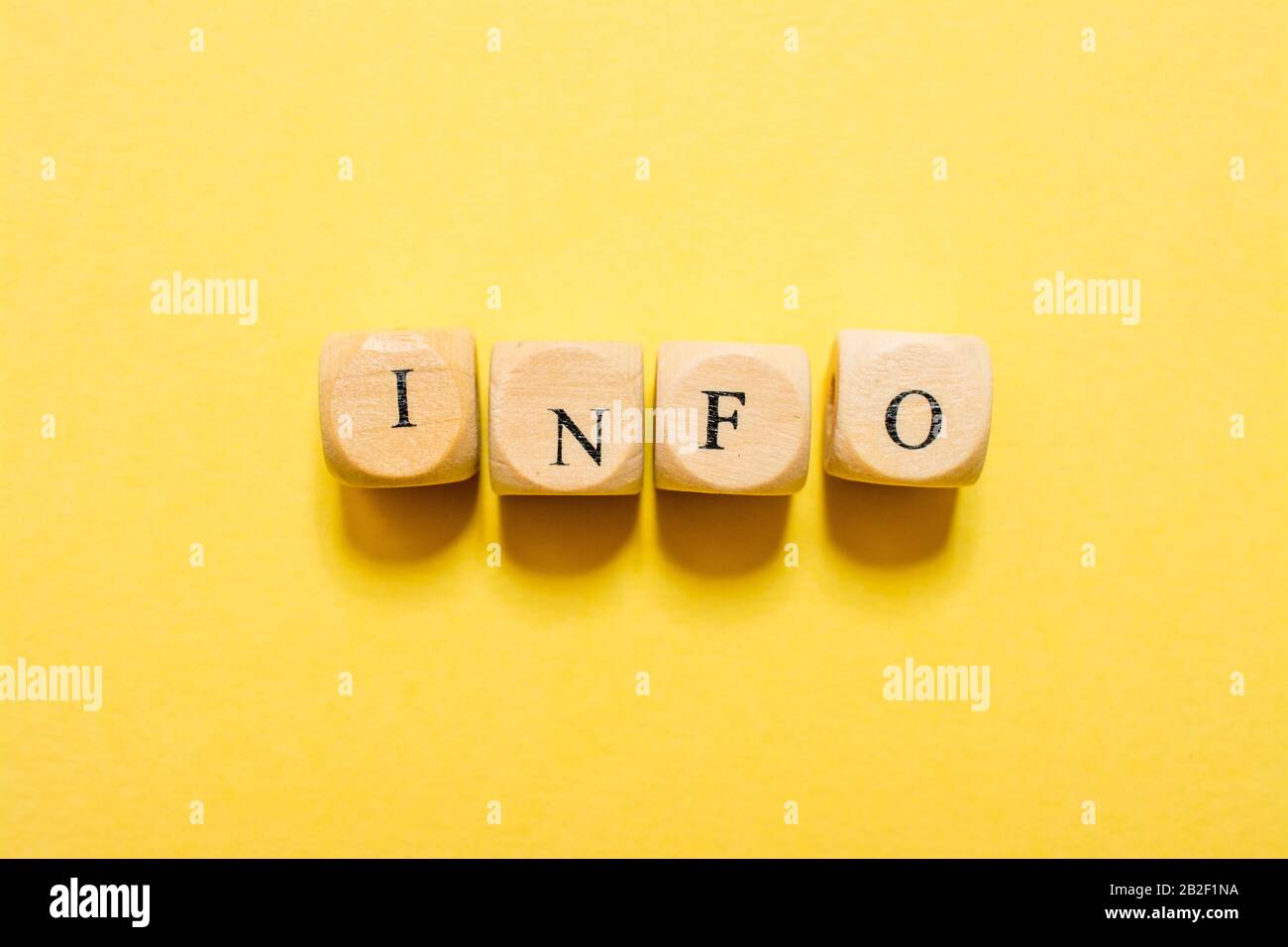 the word Info, text made with dice on yellow background Stock Photo - Alamy
