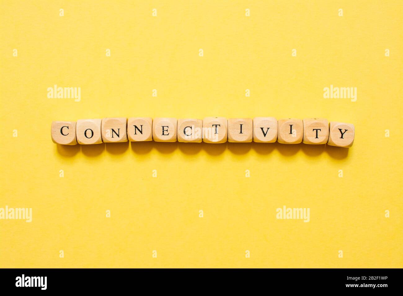 the word Connectivity, text made with dice on yellow background Stock ...