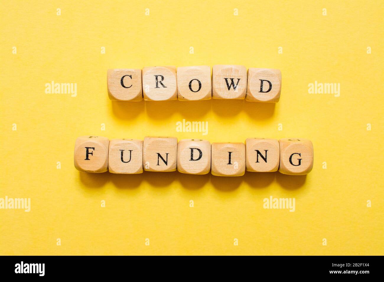 the word Crowd Funding, text made with dice on yellow background Stock ...