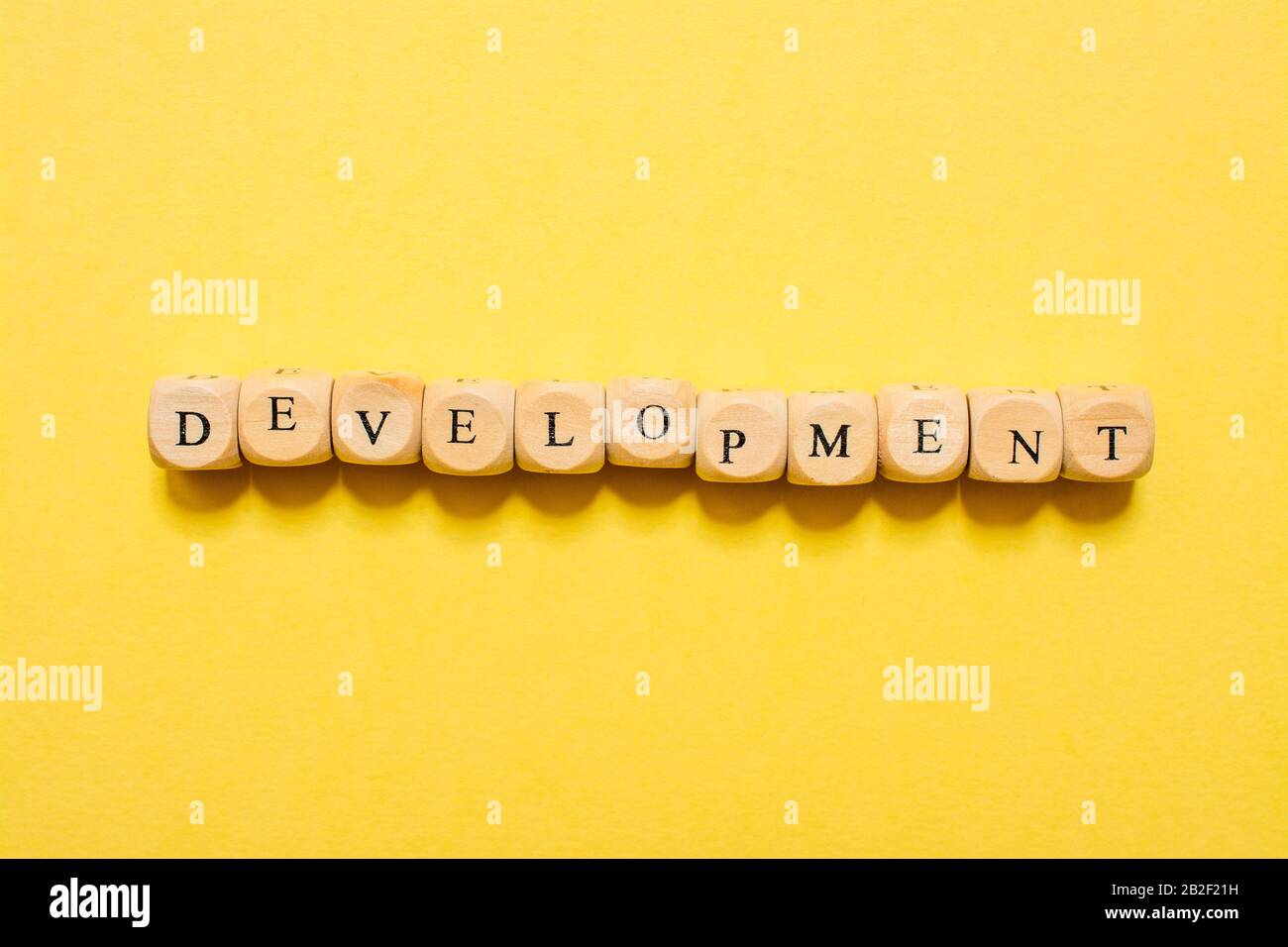 the word Development, text made with dice on yellow background Stock ...