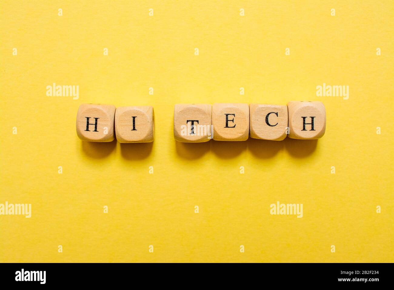 the word Hi Tech, text made with dice on yellow background Stock Photo ...