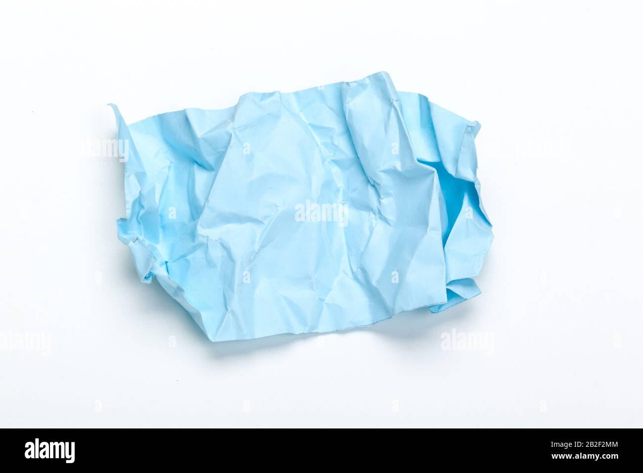 close up of a crumpled paper with curled edge on white background Stock ...