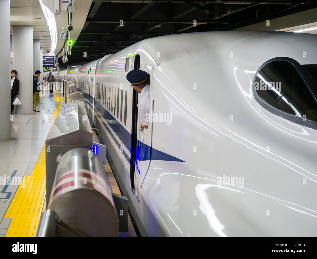 Tokyo, Japan - 13 Oct 2018: The conductor of a N700 series Shinkansen bullet train is checking ...