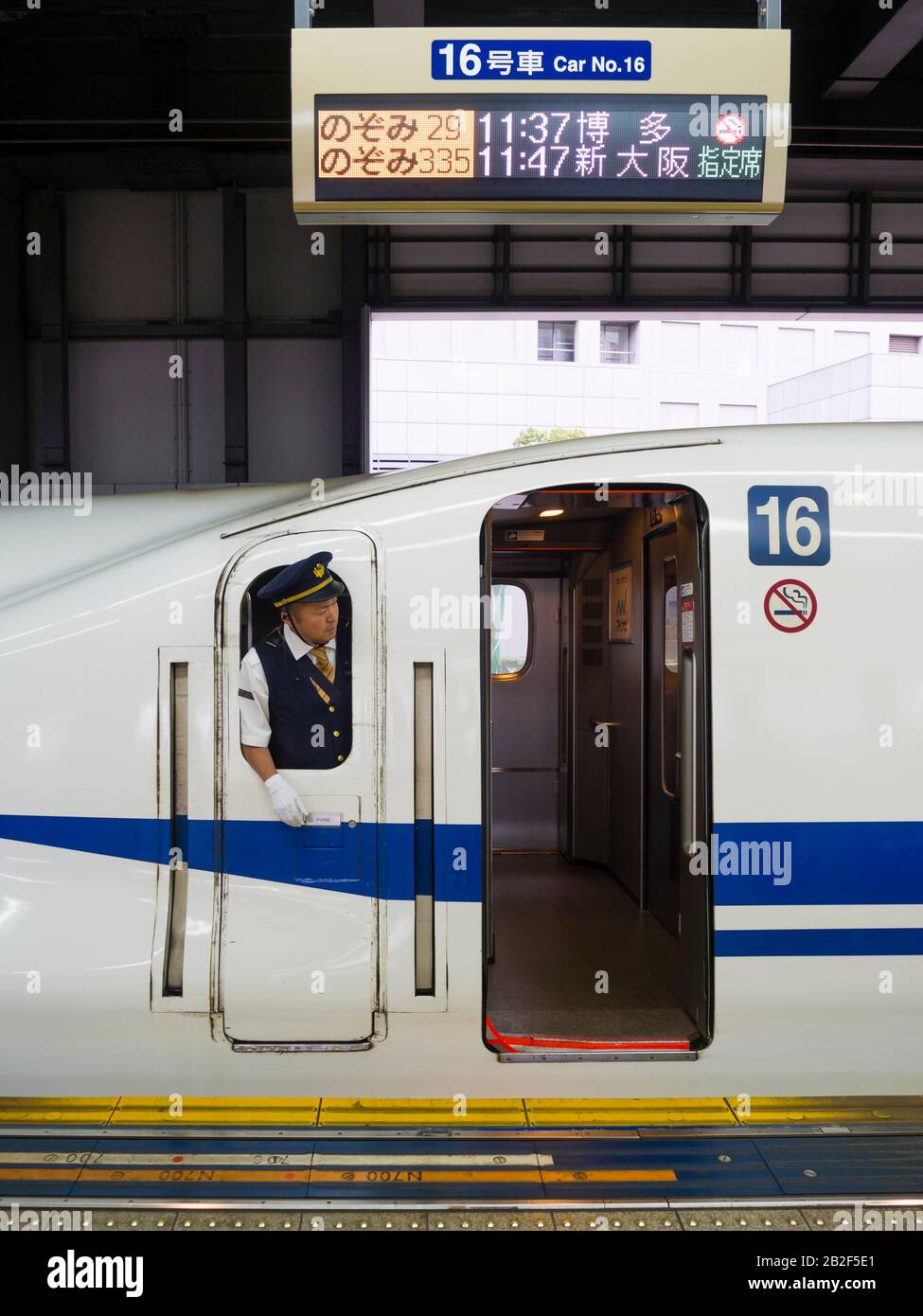 Tokyo, Japan - 13 Oct 2018: The conductor of a N700 series Shinkansen ...