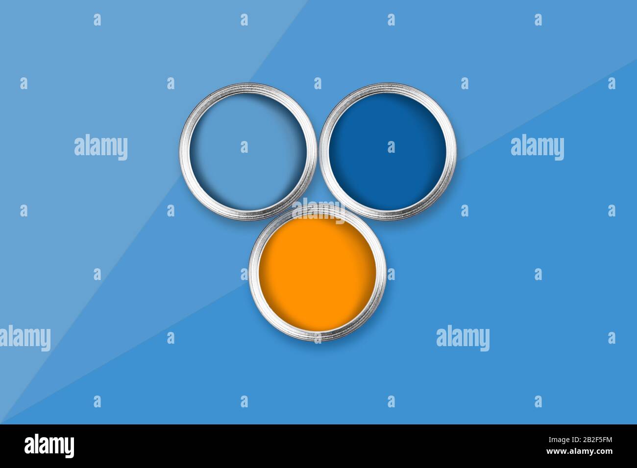 Blue background with three cans of color paint, central composition ...