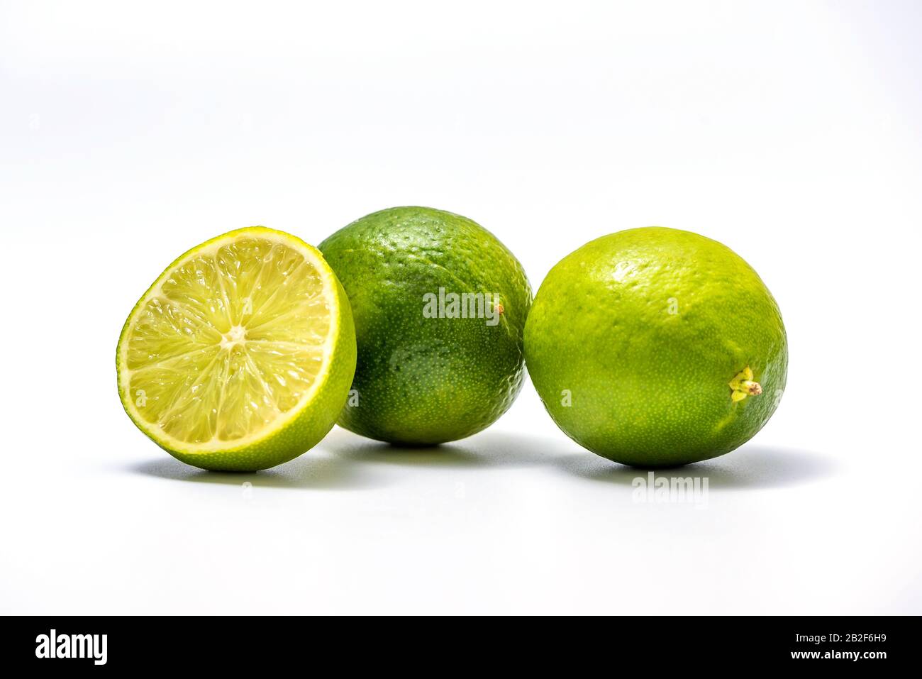 Natural fresh lime and slice of green lime citrus fruit stand isolated ...