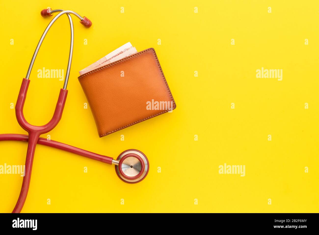 Close up doctor stethoscope and the new leather brown men wallet on ...