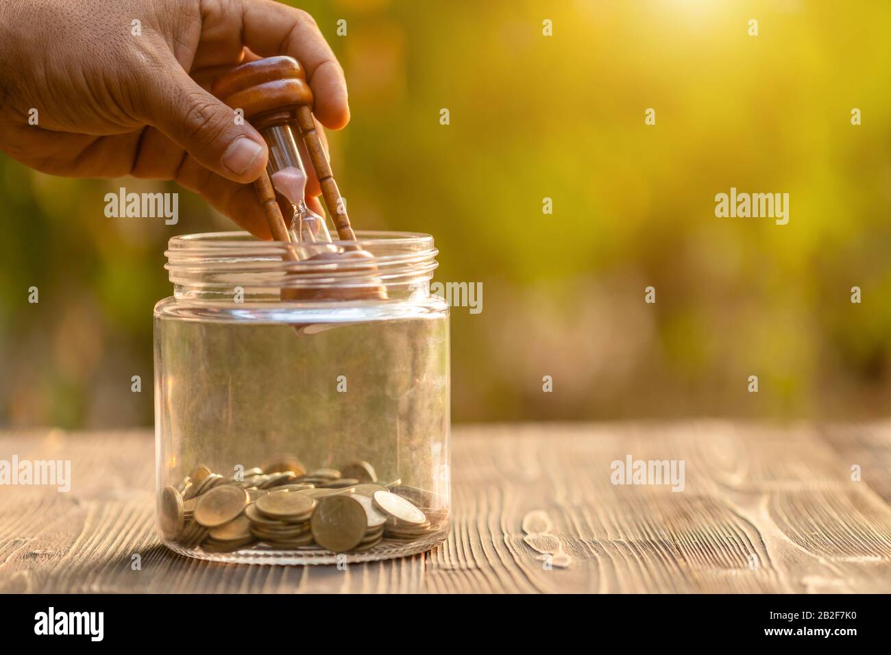 Hourglass time saving hi-res stock photography and images - Alamy