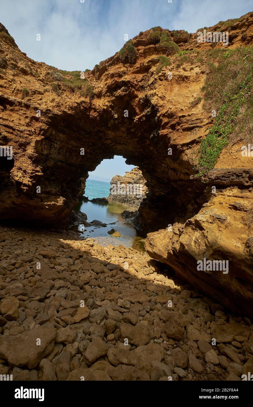 A hole at the Grotto rock formation along the Great Ocean Road ...