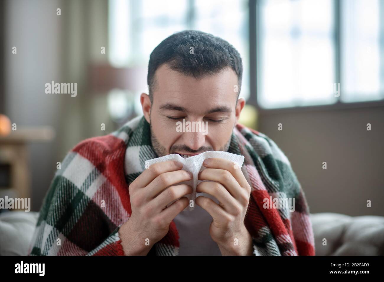 Sneezing Young Male High Resolution Stock Photography and Images - Alamy