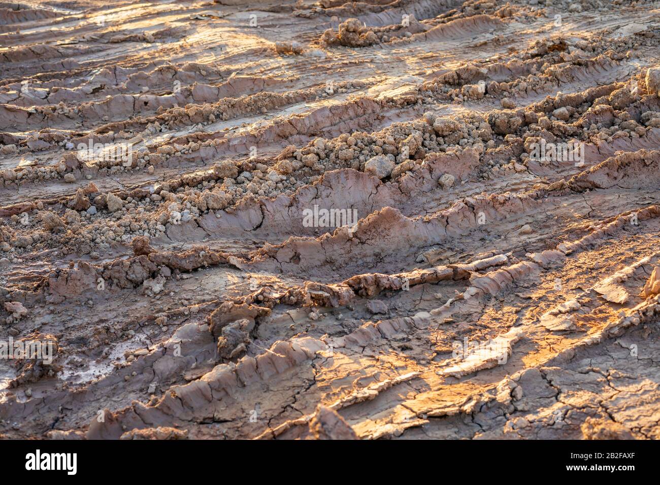 Wheel track on wet soil or mud. Dirty soil on the road after raining ...
