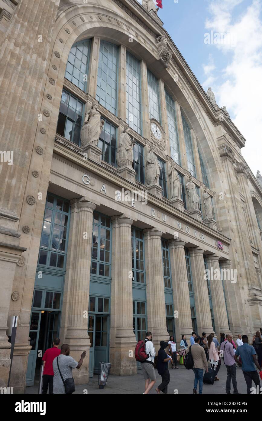 The arched facade of the Gare du Nord railway station in Paris, France ...
